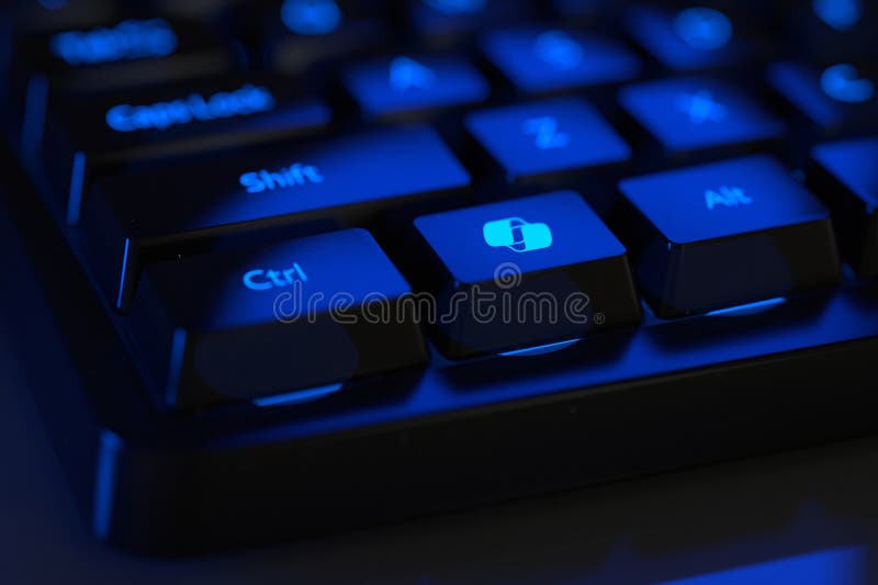 Copilot AI Logo on a Black Computer Keyboard with Blue Backlight, Close ... Copilot AI Logo on a Black Computer Keyboard with Blue Backlight, Close ...