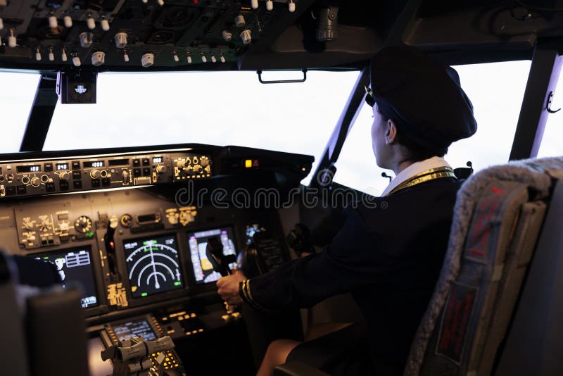 Copilot Helping Captain To Fly Airplane with Cabin Command Stock Image ...