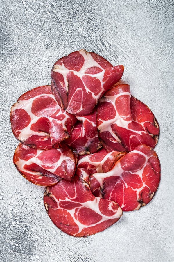Coppa Cured Ham on Kitchen Table. White Background Stock Image - Image ...