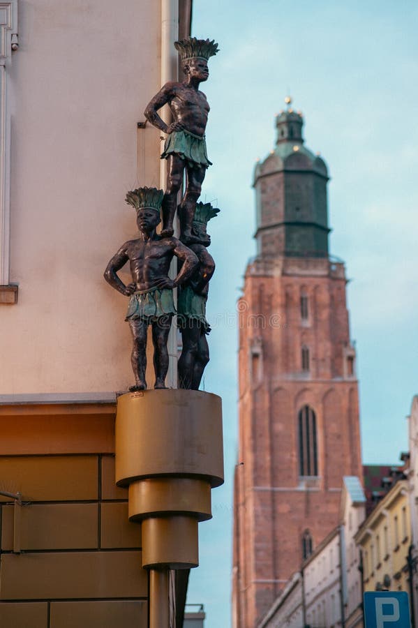 Copper Figures of Acrobats on the Wall of the Building Stock Photo ...