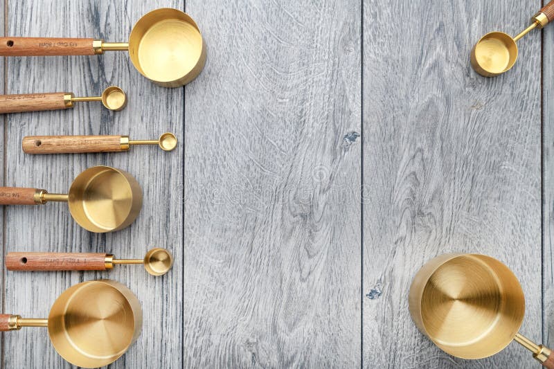 Copper Measuring Cups on a Gray Kitchen Table. View from Above Stock ...