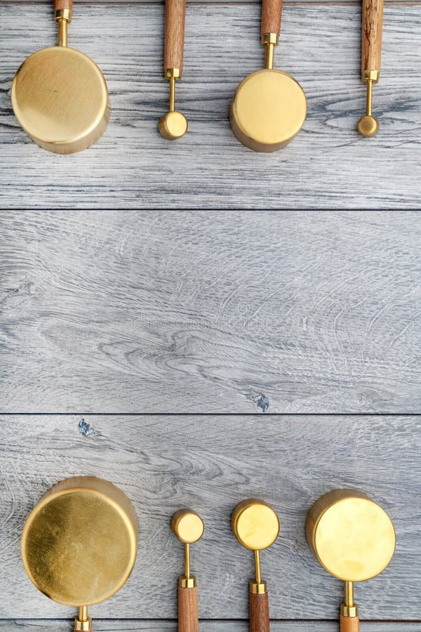 Copper Measuring Cups on a Gray Kitchen Table. View from Above Stock ...
