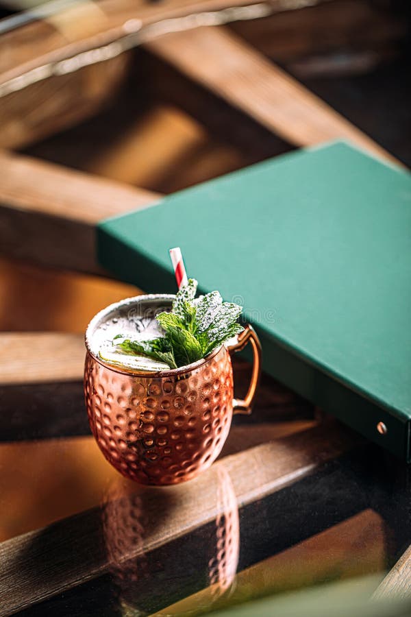 Copper Mug of Alcohol Cocktail on a Glass Table Stock Image - Image of ...