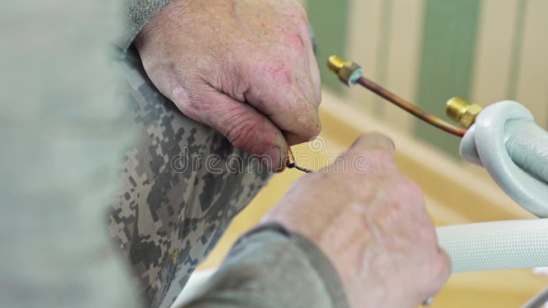 Chamfering of Copper Pipe. Process of Removing Pointed Edge at End of ...