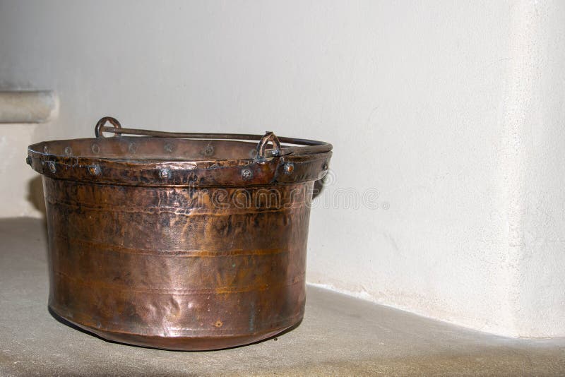 Copper Pot on the Background of a White Wall Stock Image - Image of ...