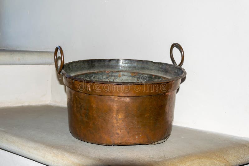 Copper Pot on the Background of a White Wall Stock Photo - Image of ...