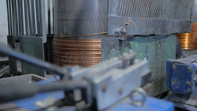 Winding a Copper Cable on a Rotating Coil. Production of Electric Cable ...