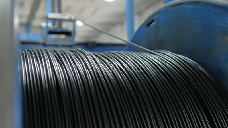 Winding Cable on a Rotating Coil. Production of Electric Cable. Stock ...