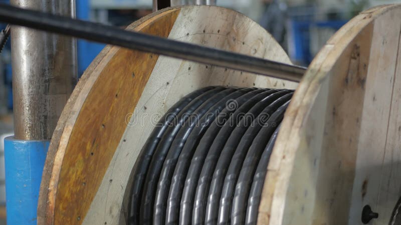 Winding Cable on a Rotating Coil. Production of Electric Cable. Stock ...