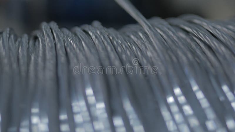Winding Cable on a Rotating Coil. Production of Electric Cable. Stock ...