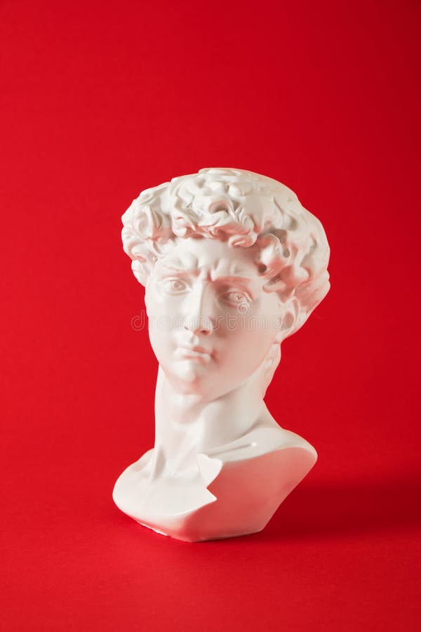 Copy of the Head of an Antique Statue of David on a Red Background ...