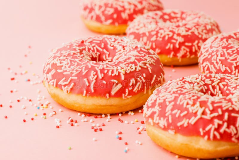Coral Donuts. Donuts Decorated with Icing on Pink Background Stock ...