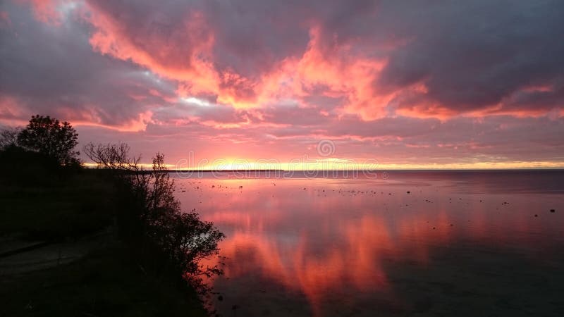 Coral Sunset stock photo. Image of sunset, coral, clouds - 70627852