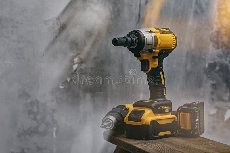 A Cordless Drill and an Impact Driver Rest on a Wooden Surface. Tools ...