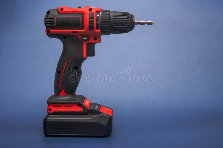 Cordless Screwdriver in Close-up on Blue Background, Showcasing Modern ...