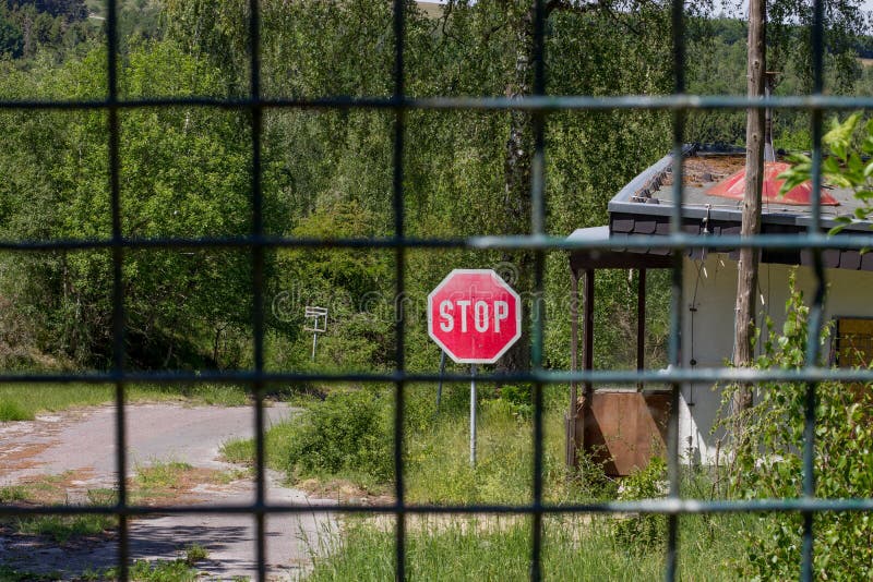 Cordoned Off Path in the Forest with a Stop Sign Stock Image - Image of ...