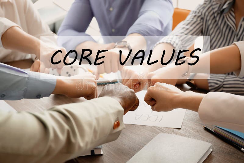 Core Values Concept. People Putting Hands at Table, Closeup Stock Photo ...
