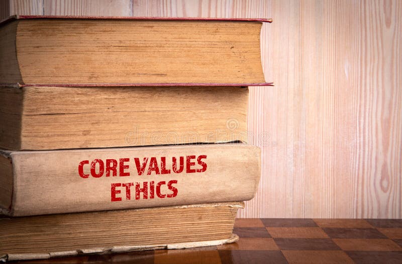 Core Values and Ethics. Stack of Old Books on a Wooden Background Stock ...