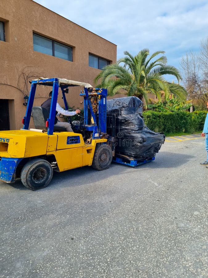 Forklift Transporting a Wrapped Item Editorial Photo - Image of ...