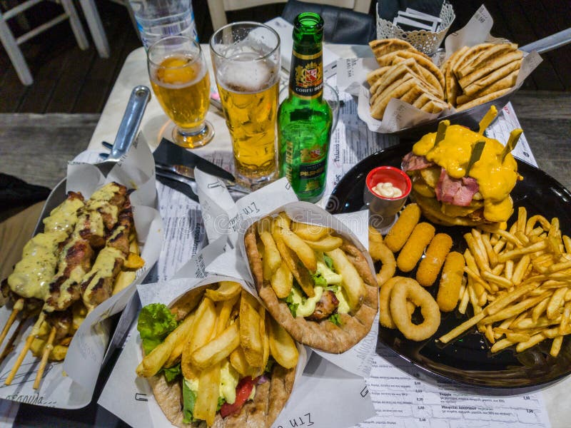 Greek Feast with Mythos Beer Editorial Stock Photo - Image of fast ...