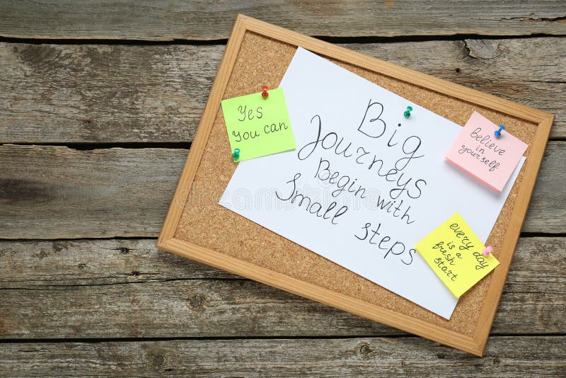 Corkboard with Motivational Quotes on Wooden Table, Top View Stock ...