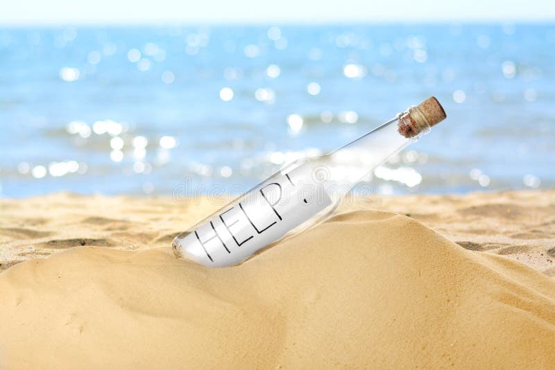 Corked Glass Bottle with Rolled Paper Note on Sandy Beach Near Ocean ...
