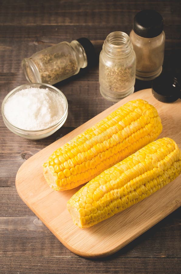 Corn. Appetizing Boiled Corn with Salt and Seasonings on a Wooden Table ...
