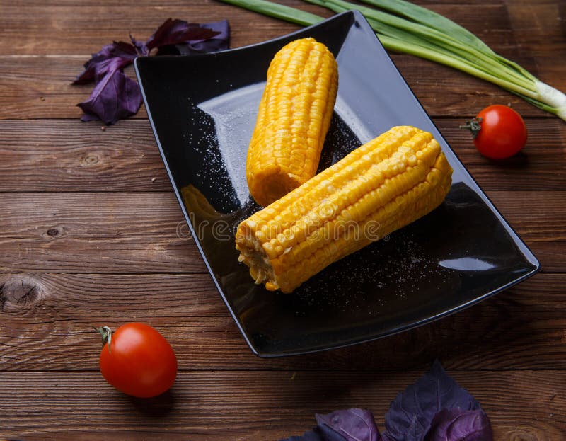 Corn on the Black Plate on Wooden Table Stock Image - Image of health ...