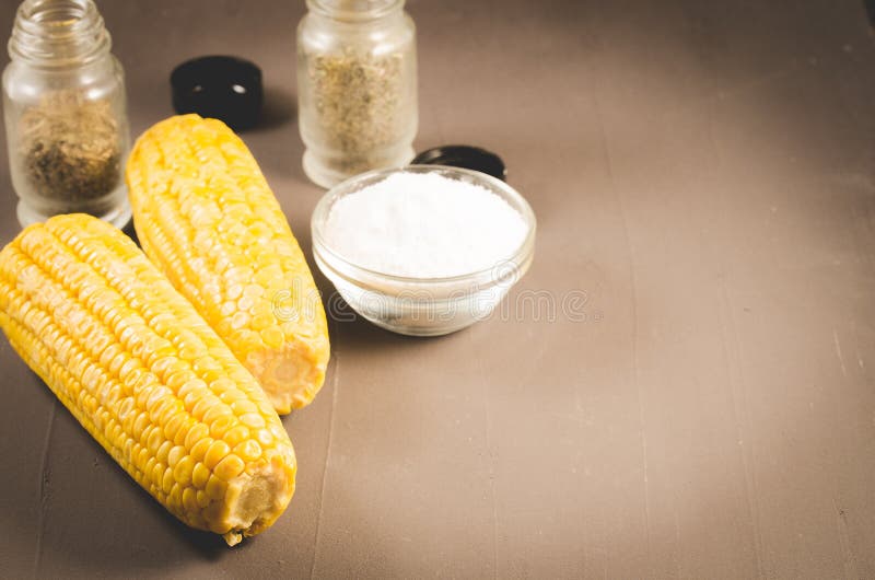 Corn. Boiled Corn with Salt and Seasonings on a Dark Table Stock Photo ...