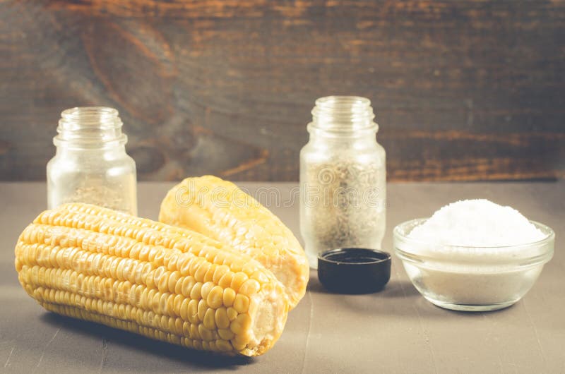 Corn. Boiled Corn with Salt and Seasonings on a Dark Table Stock Photo ...