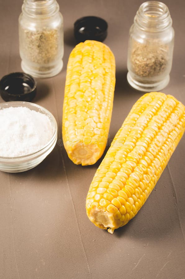 Corn. Boiled Corn with Salt and Seasonings on a Dark Table Stock Image ...