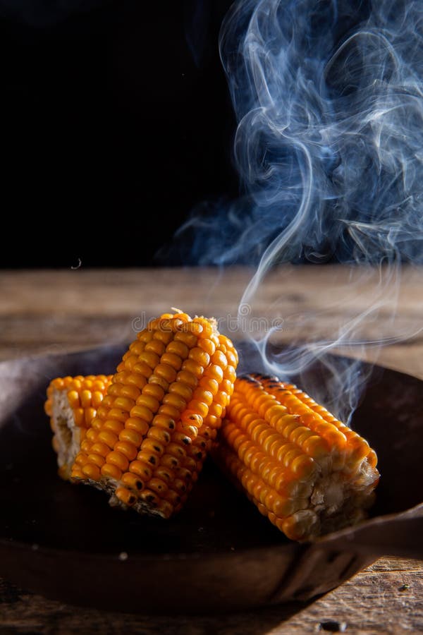 Corn Cob on a Cast Iron Skillet and Wood Surface Stock Image - Image of ...