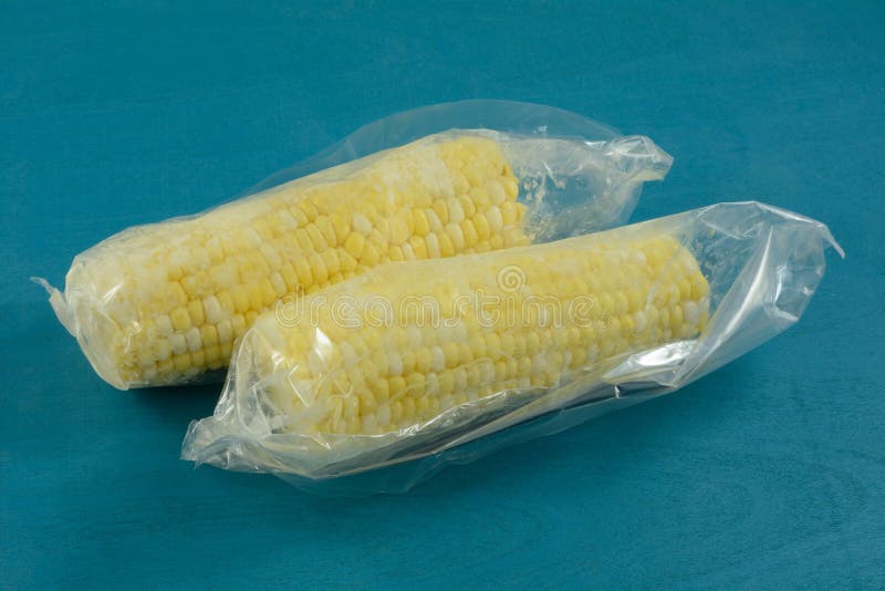 Corn on the cob in plastic stock image. Image of organic - 98478007