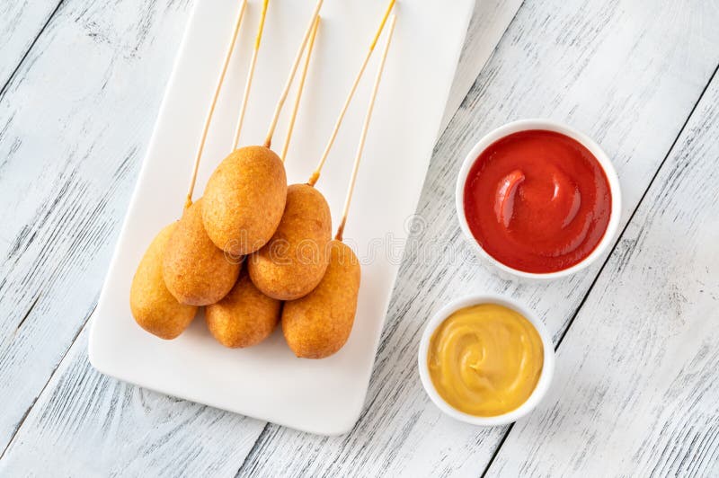 Corn Dogs on White Serving Plate Stock Photo - Image of sauce, mini ...