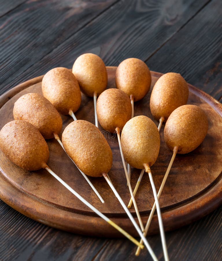 Corn dogs on wooden board stock photo. Image of fair - 201162486