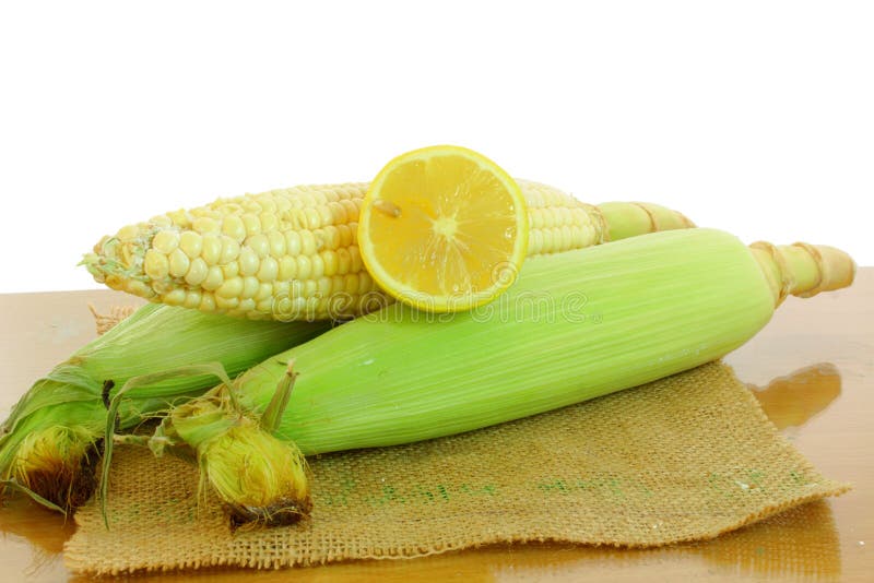 Corn ear with cut lemon stock image. Image of nursery - 35341481