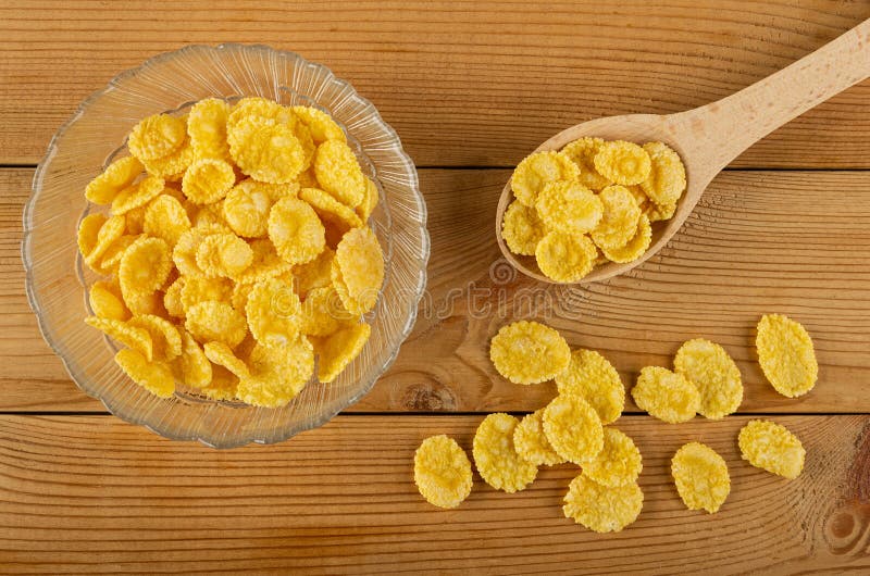 Corn Flakes in Bowl, Spoon with Cornflakes, Scattered Cornflakes on ...