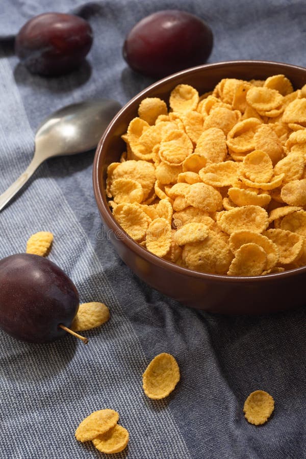 Corn Flakes in a Bowl on the Table with Fruits Stock Photo - Image of ...