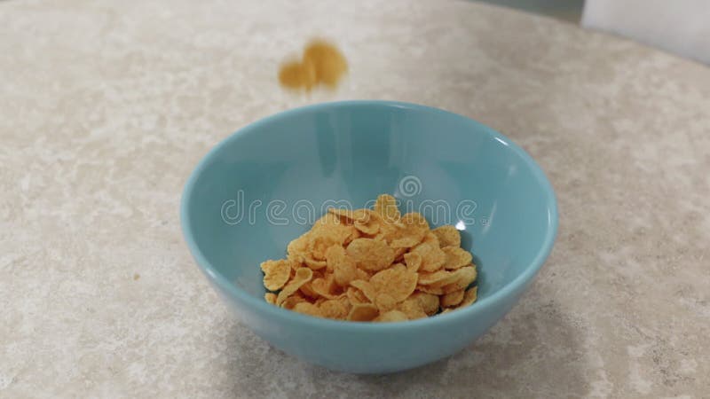 Corn Flakes Falling and Filling a Blue Bowl Stock Video - Video of food ...