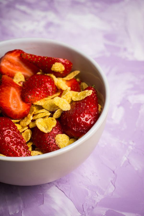 Corn Flakes with Fresh Strawberry in Bowl on the Rustic Background ...