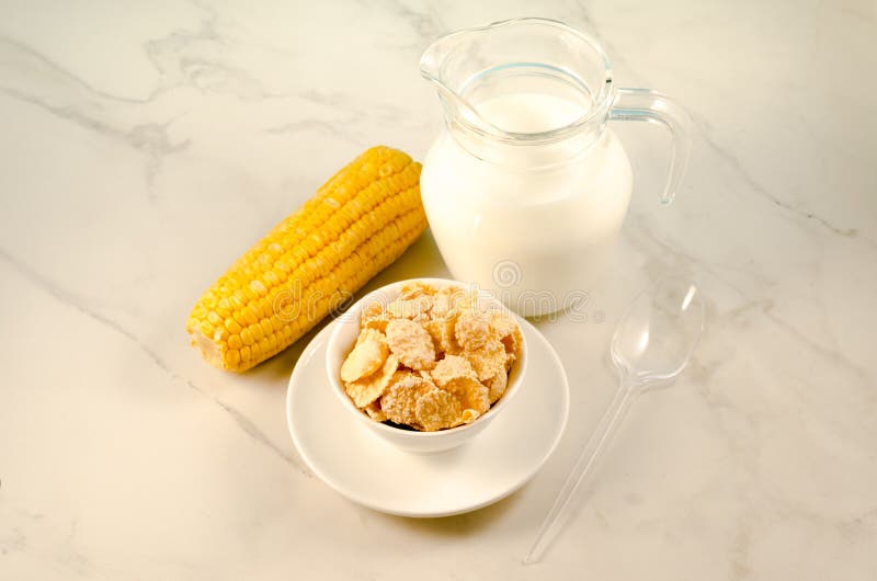 Corn with Flakes and Milk/ Corn Flakes with Milk and a Corn Ear on a ...