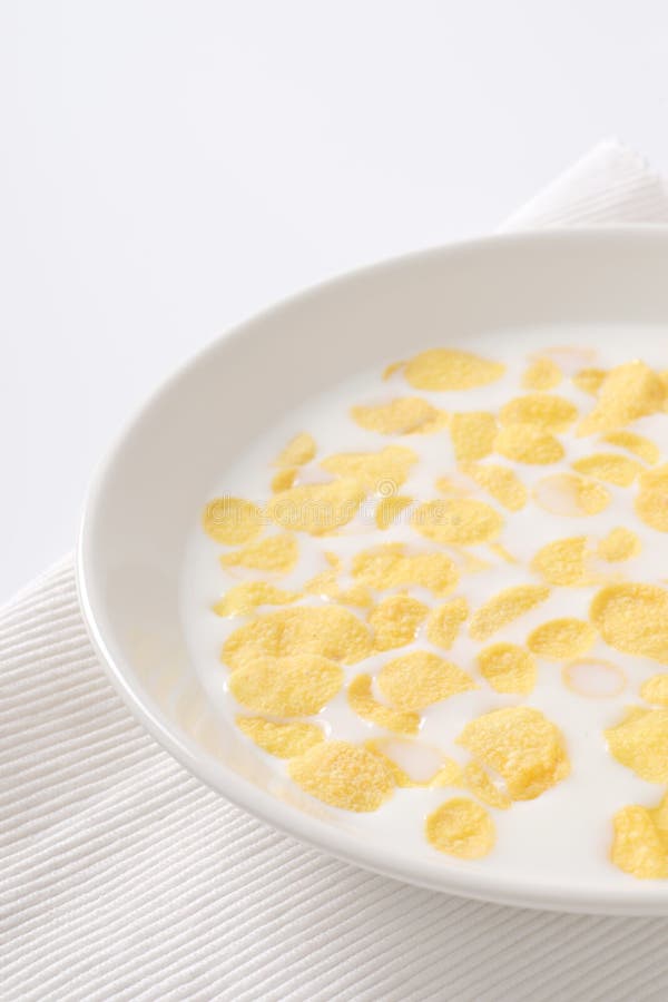 Corn flakes with milk stock photo. Image of tasty, plate - 76567494