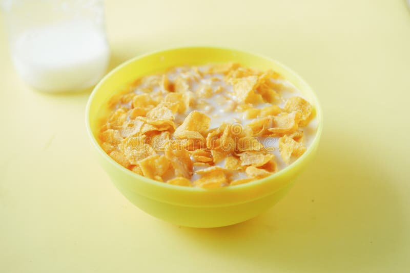Corn Flakes and Milk in a Yellow Color Bowl Stock Image - Image of ...