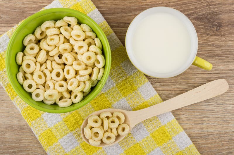 Corn Flakes Rings in Bowl, Spoon and Cup of Milk Stock Image - Image of ...