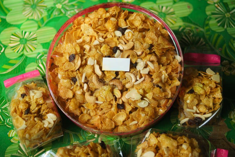 Corn Flakes in a Round Clear Plastic Box on the Green Table Stock Photo ...