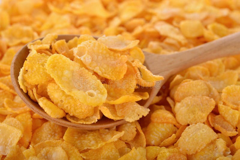 Corn Flakes with Wooden Spoon and on Pile of Corn Flakes Stock Image ...