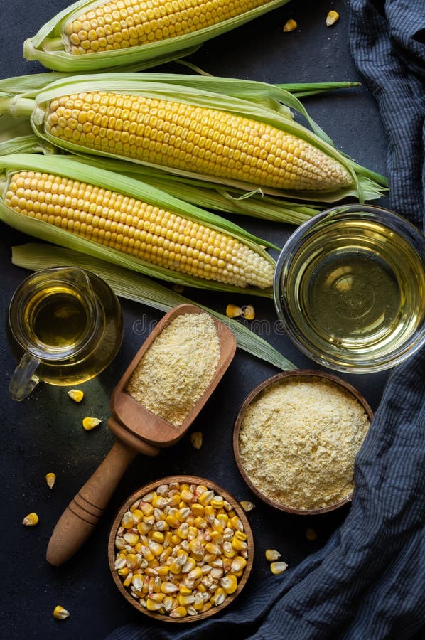 Corn Oil and Corn Flour with Fresh Corncobs on Rustic Table Stock Photo ...