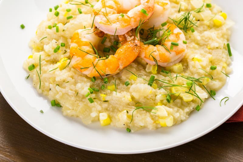 Corn Risotto with Roasted Shrimp Stock Photo - Image of evening, napkin ...