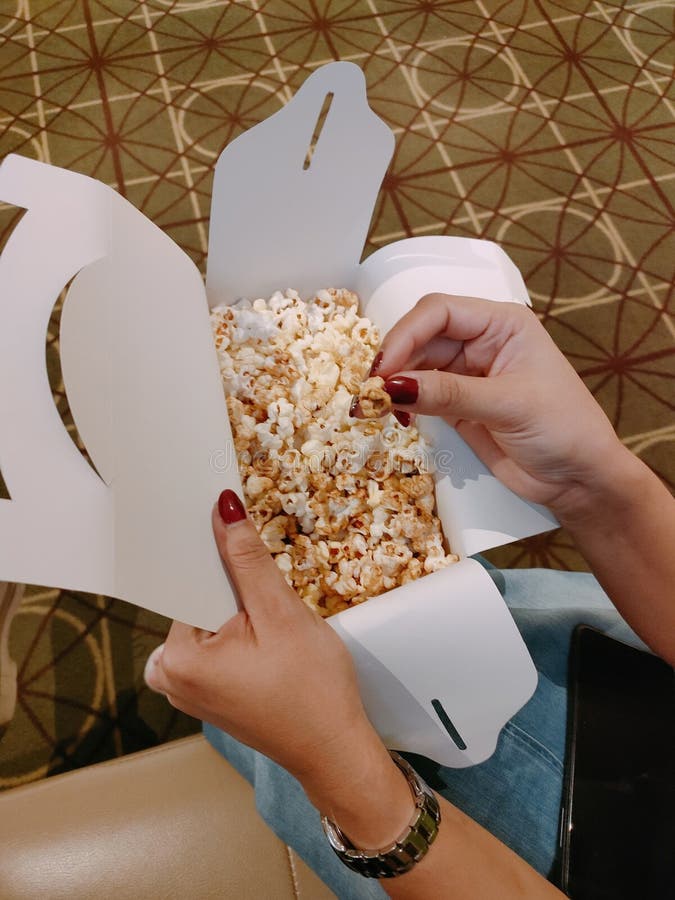 Corn snacks while watching stock image. Image of sweetness - 285370467