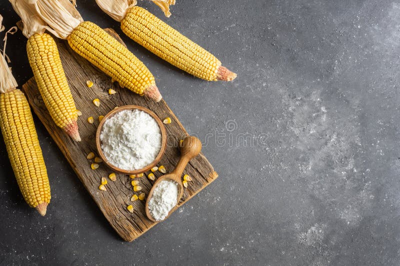Corn Starch in Bowl and Spoon with Dried Corn Groats, Kernels on Rustic ...
